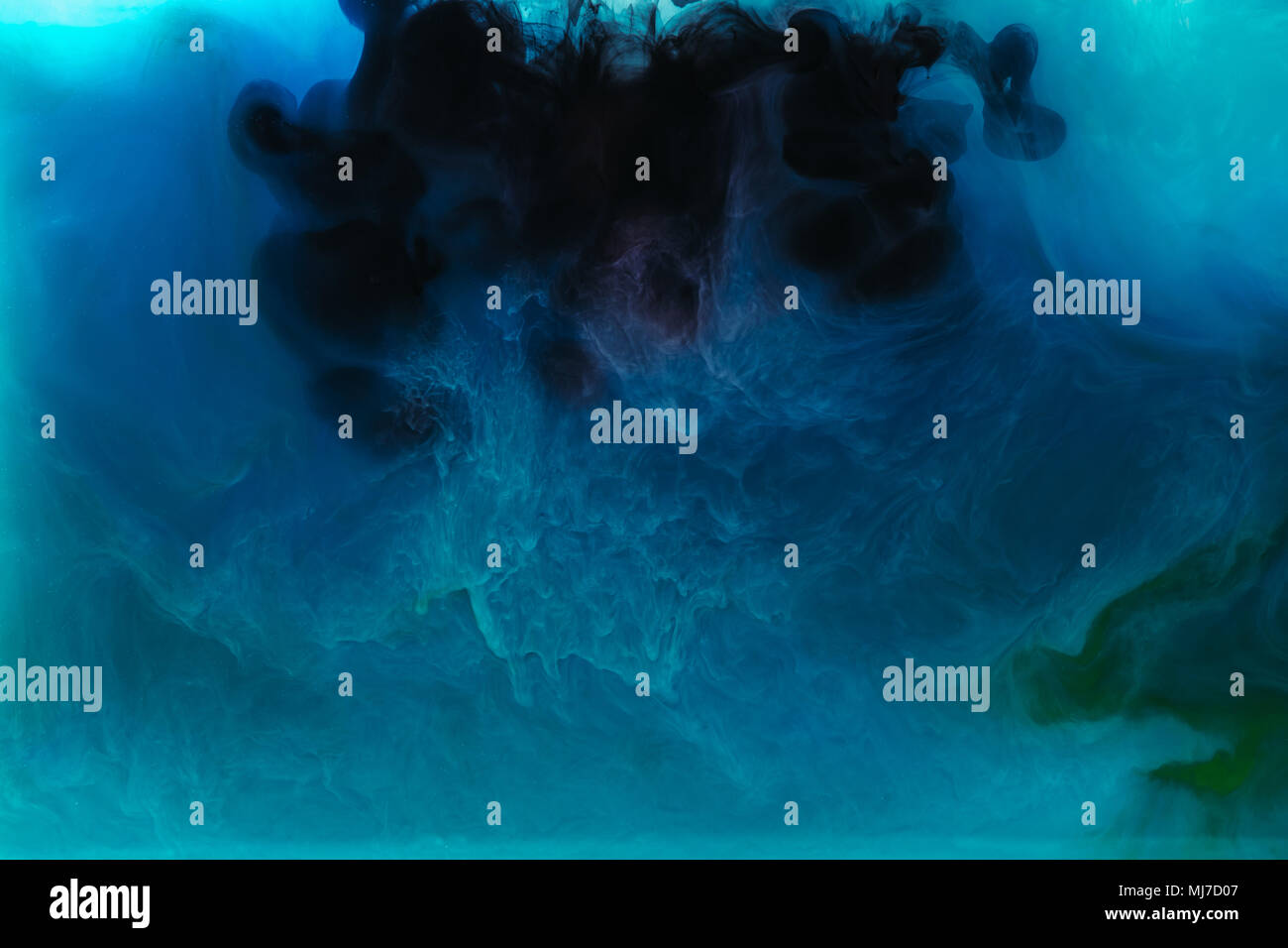full frame image of mixing of blue, black, turquoise and green paints ...