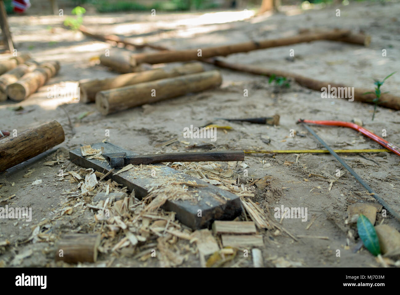 Axe and other building tools lies on the ground in the jungle Stock ...
