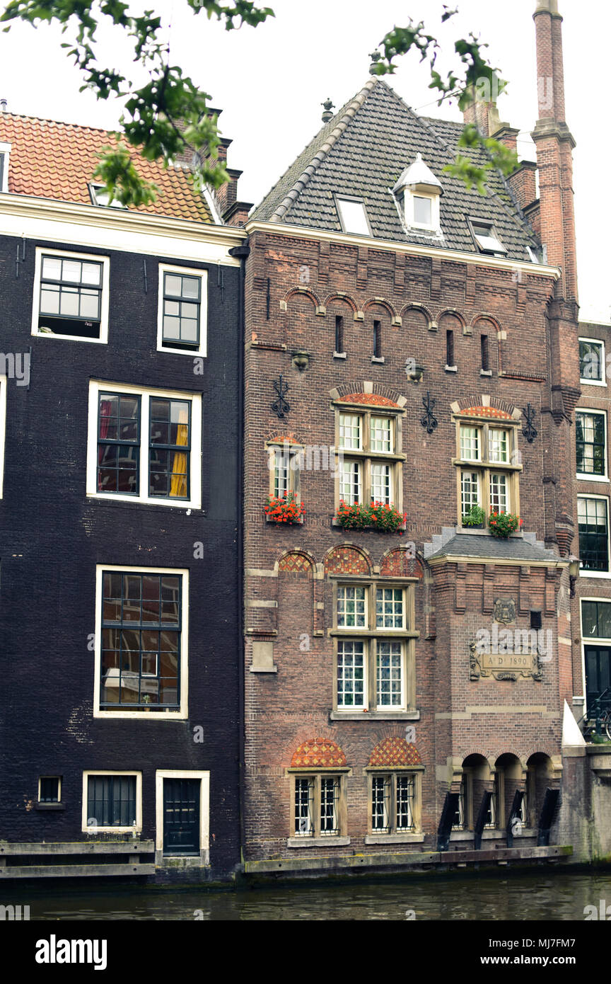 Old traditional dutch buildings near the Amstel canal. The street of ...
