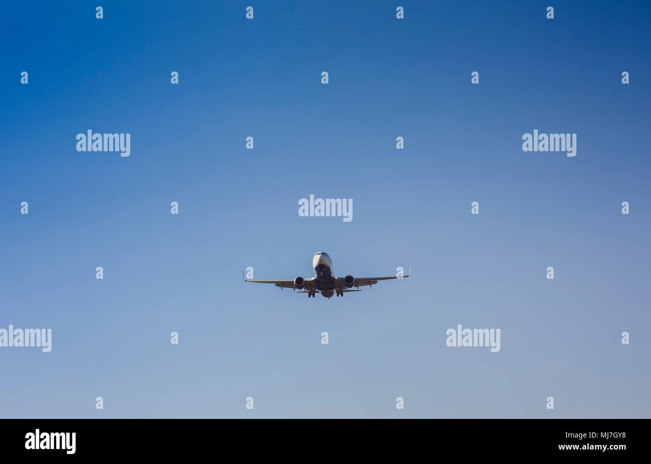 big commercial airplane at landing with clear blue sky background Stock ...