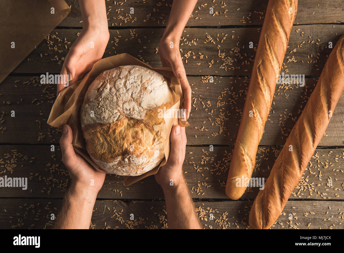 whole wheat bread in hands Stock Photo - Alamy