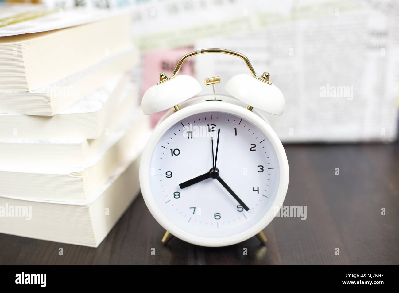 Close up white vintage clock on blur background Stock Photo - Alamy
