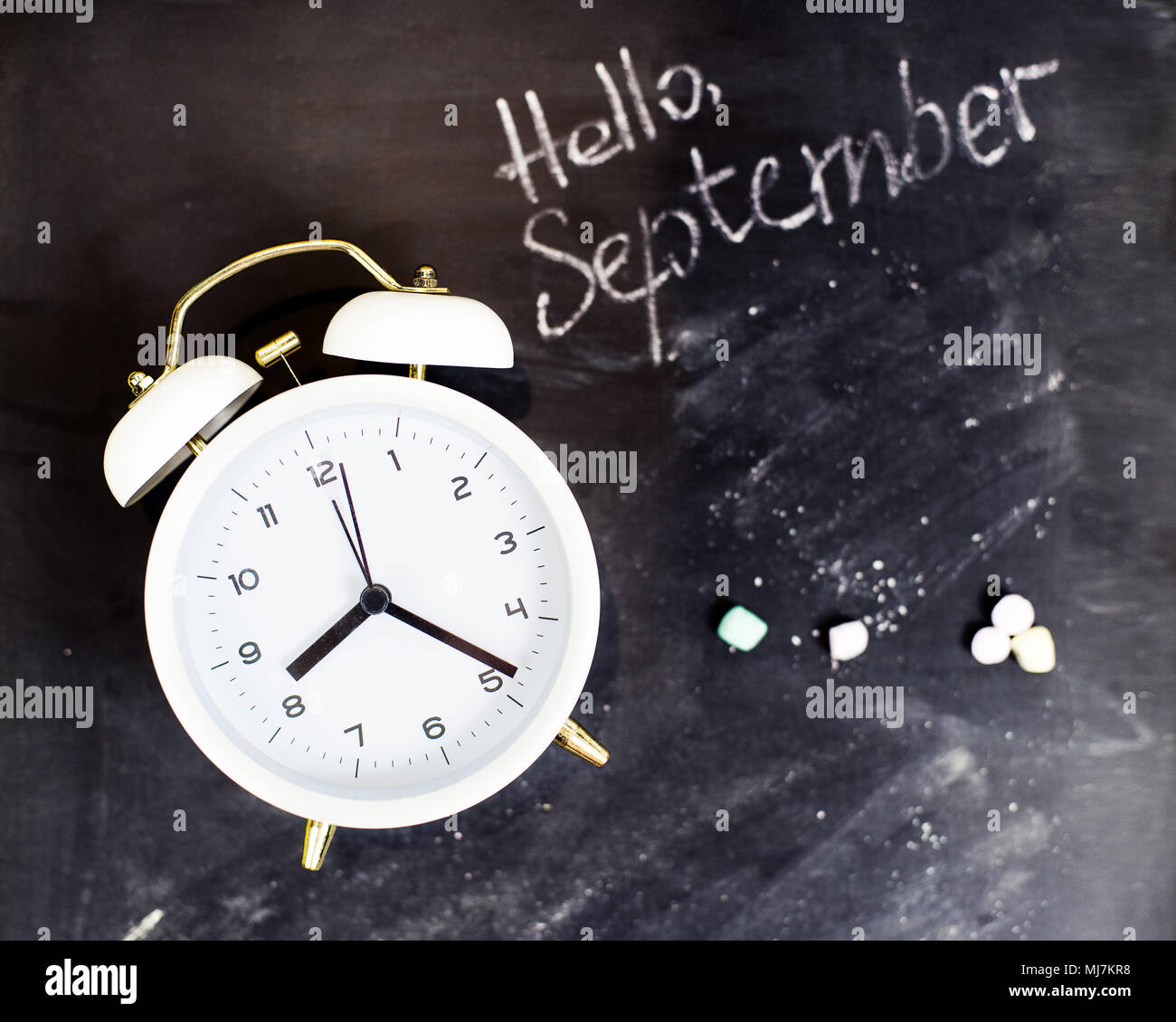 Close up white vintage clock on blur background Stock Photo - Alamy
