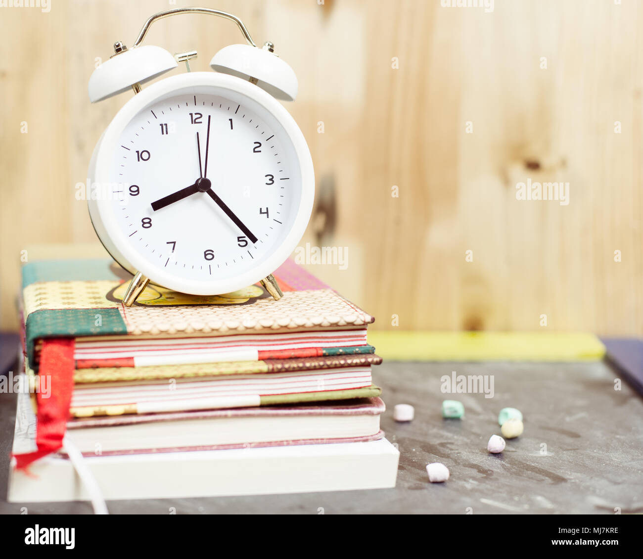 Close up white vintage clock on blur background Stock Photo - Alamy