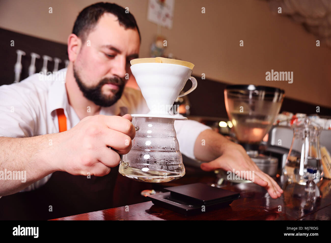 Drip coffee or pour-over coffee on the scale and professional coffee ...