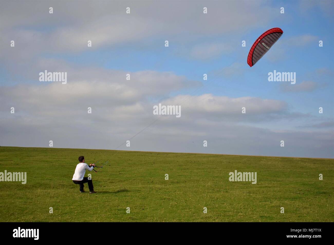 Kite flying a bullet kite one Cleeve Hill Stock Photo - Alamy