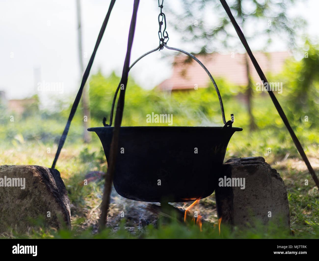 Gulyas stew boiling in a cauldron Stock Photo - Alamy