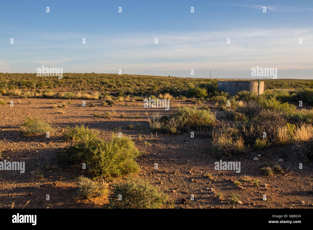 Sunrise over a small farm dam in the countryside in the Karoo natural ...