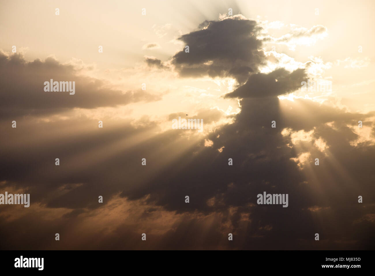 Cumulus sunset clouds with colorful sun setting downs Stock Photo - Alamy