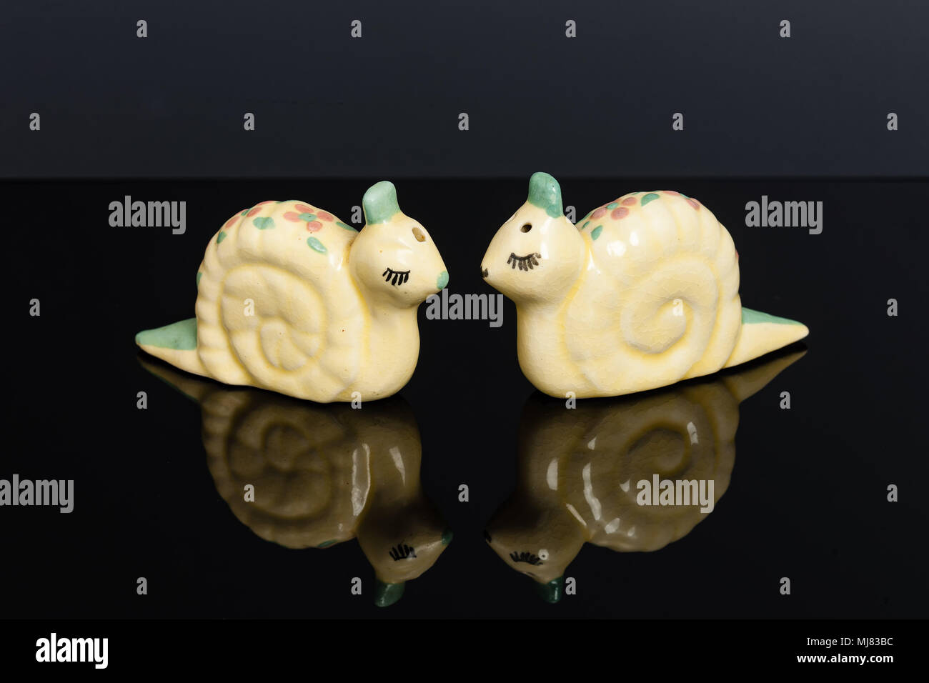 green and yellow ceramic snail salt and pepper shaker set Stock Photo ...