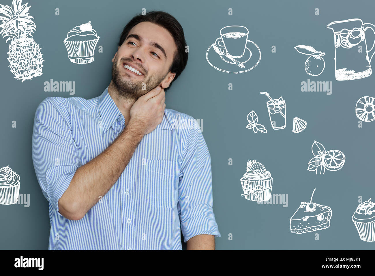 Hungry young man smiling while being in a new cafe Stock Photo - Alamy