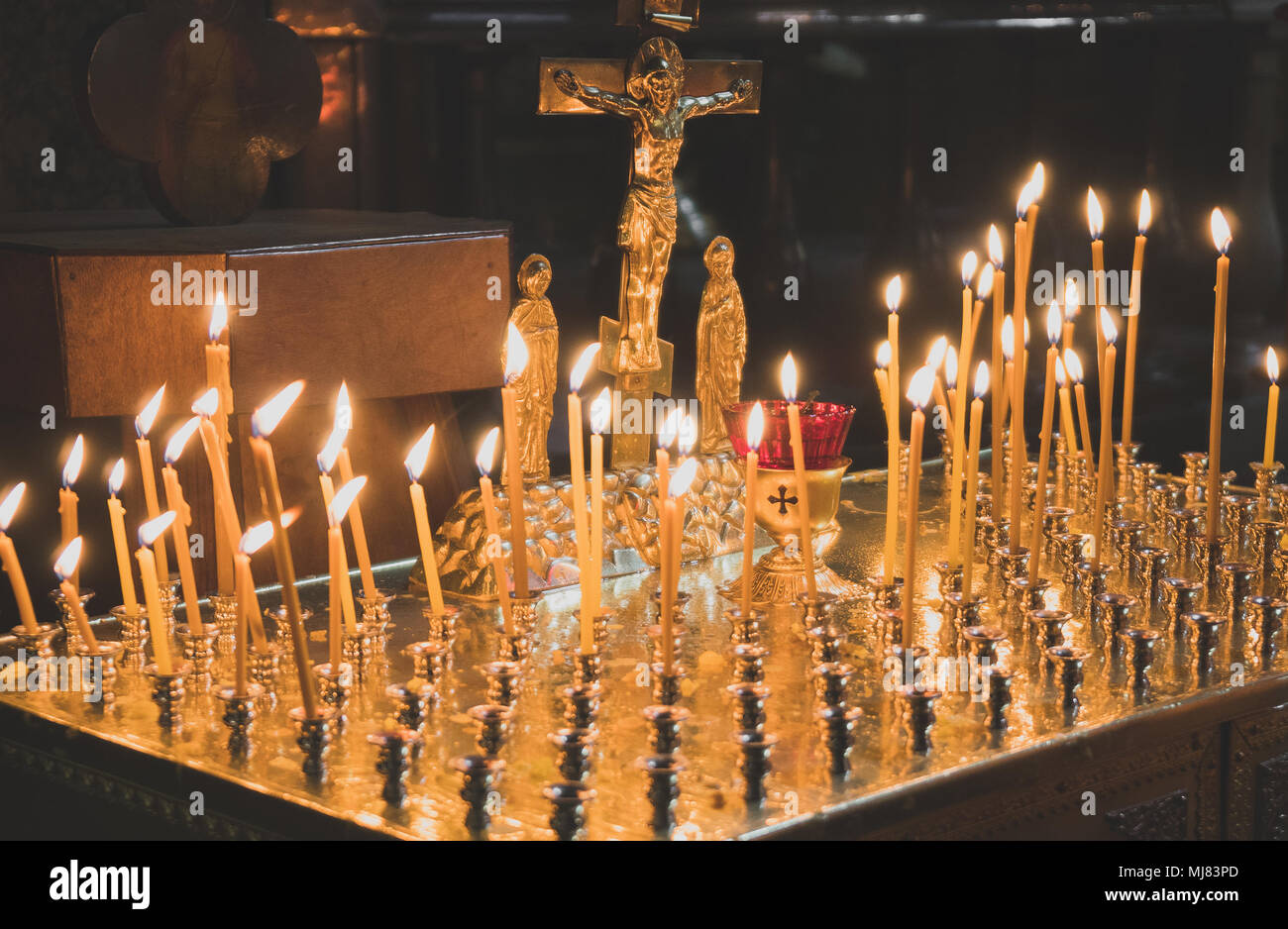 Many candles glowing hi-res stock photography and images - Alamy