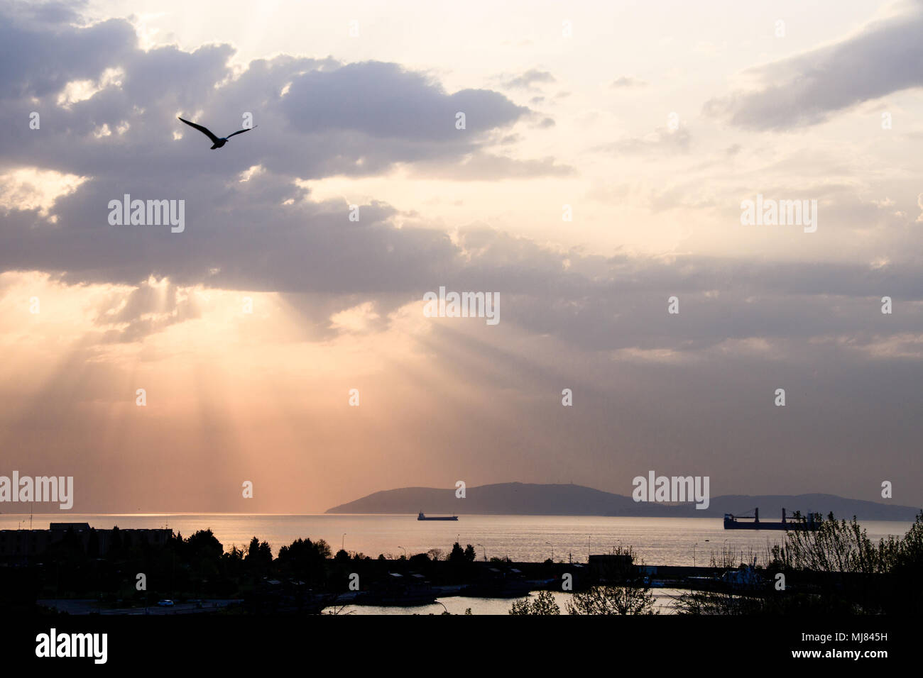 Cumulus sunset clouds with colorful sun setting downs Stock Photo - Alamy