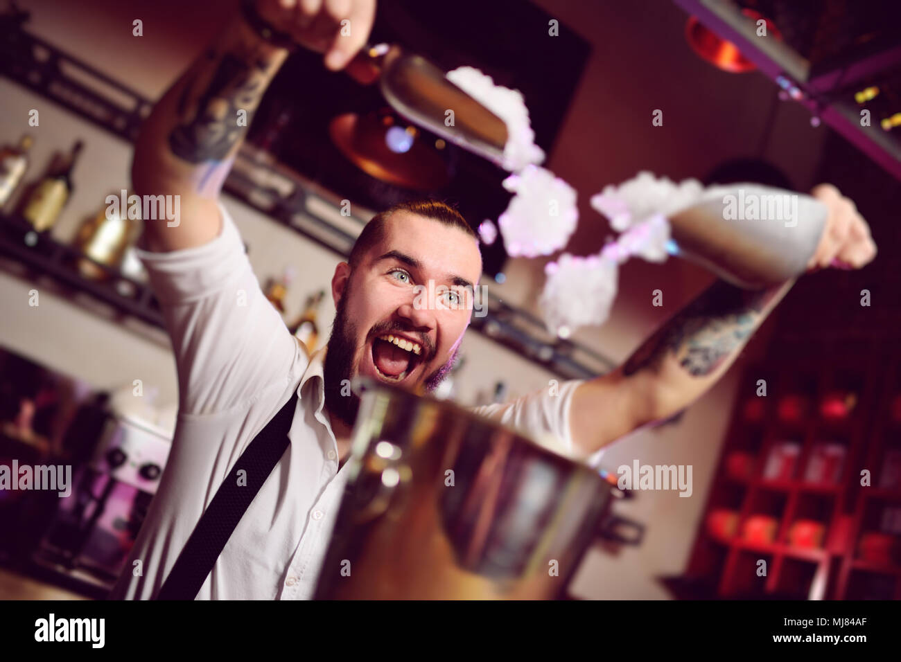 cheerful barman smiles, screams and falls asleep in a bucket for ...