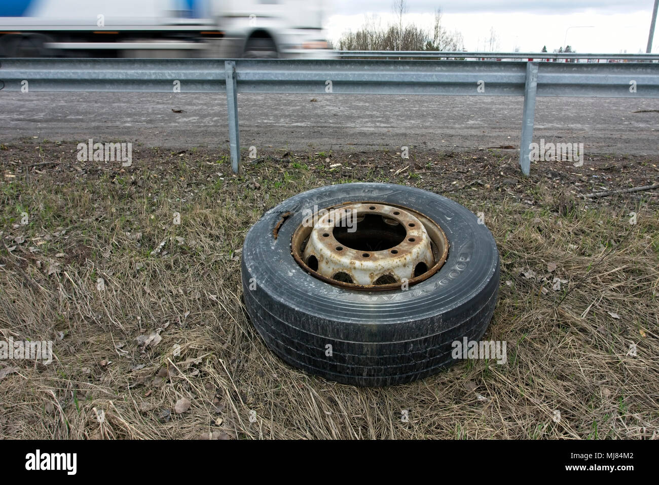broken truck tyre on roadside, Finland Stock Photo - Alamy