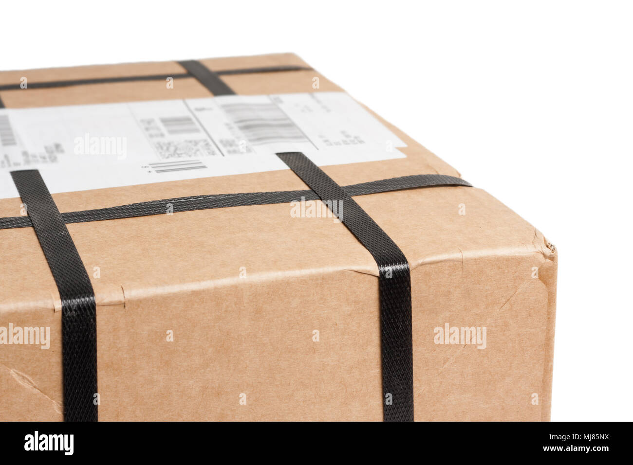 Parcel with strapping isolated on white background Stock Photo - Alamy