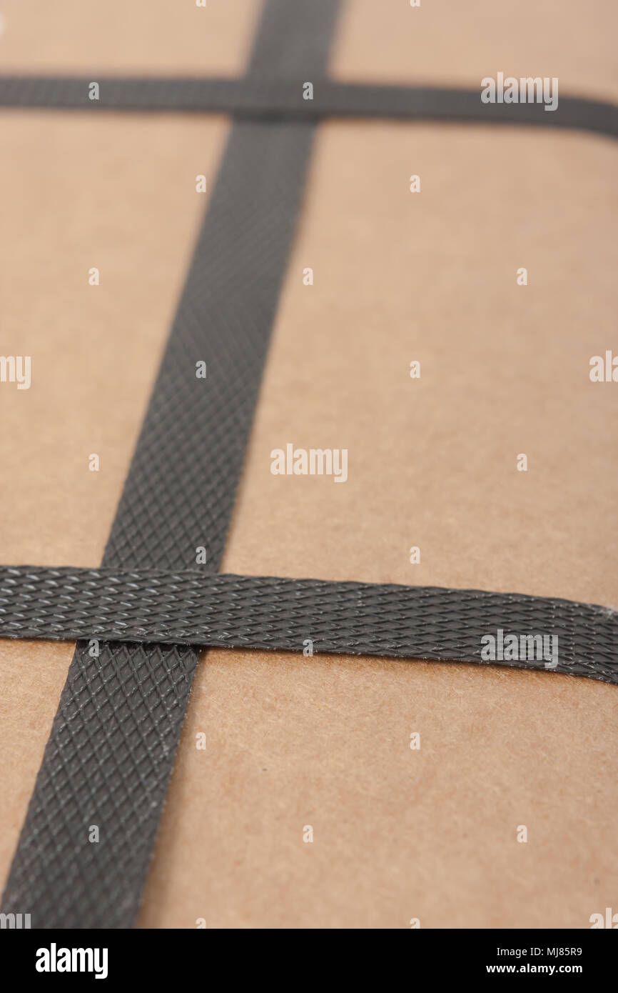 Cardboard with strapping Stock Photo - Alamy