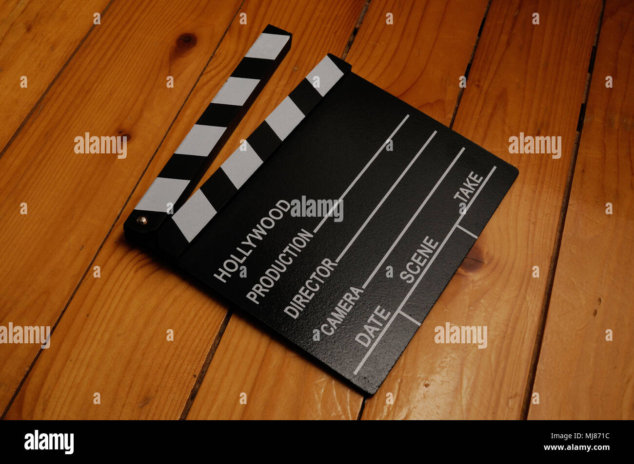 Production slate clapboard close up on wooden background Stock Photo ...