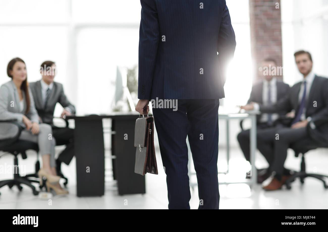 Adult students listen to professor's lecture in small class room Stock ...