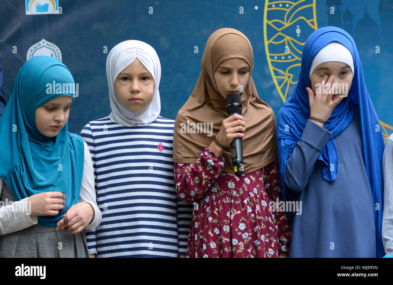 Muslim Crimean Tartar children standing on stage, one of them speaking ...