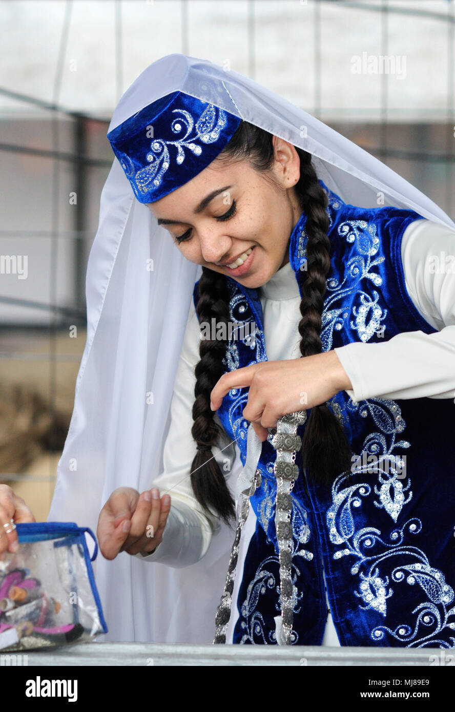 Crimean tatar dancer in native dress preparing for concert, dressing up ...
