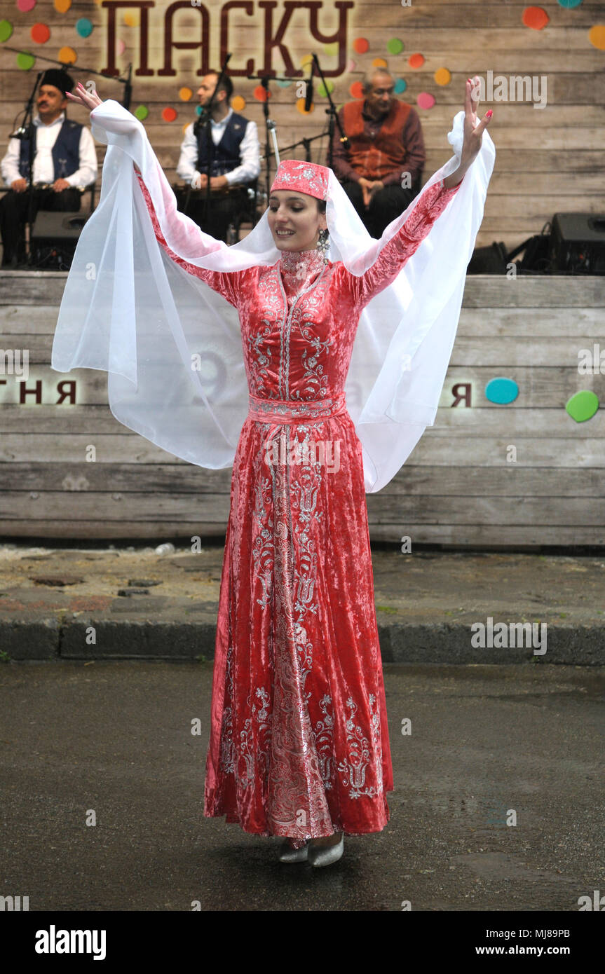 Crimean tatar dancer in a native dress performing native dance on stage ...