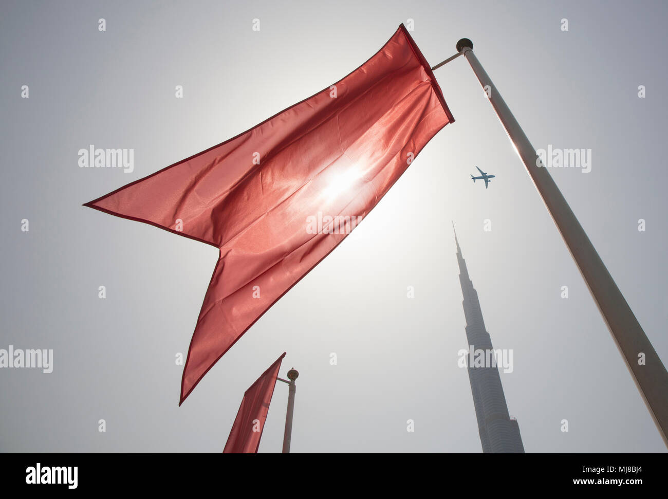 Bright red flag hi-res stock photography and images - Alamy