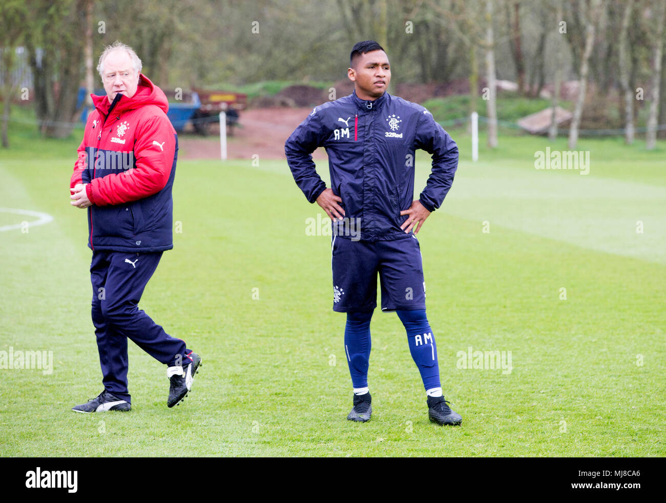 Rangers' Jimmy Nicholl watches over Alfredo Morelos during training at ...