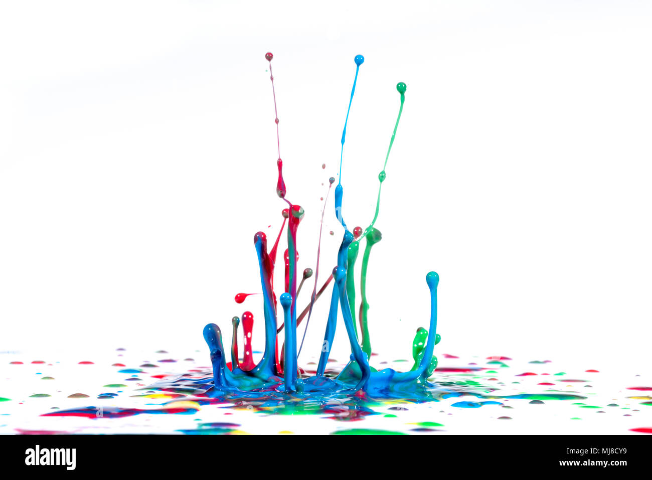 Splash of color ink on white background Stock Photo - Alamy