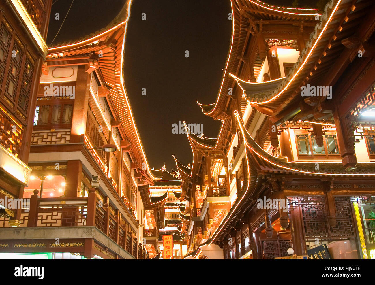 Low angle view of illuminated traditional oriental buildings with ...
