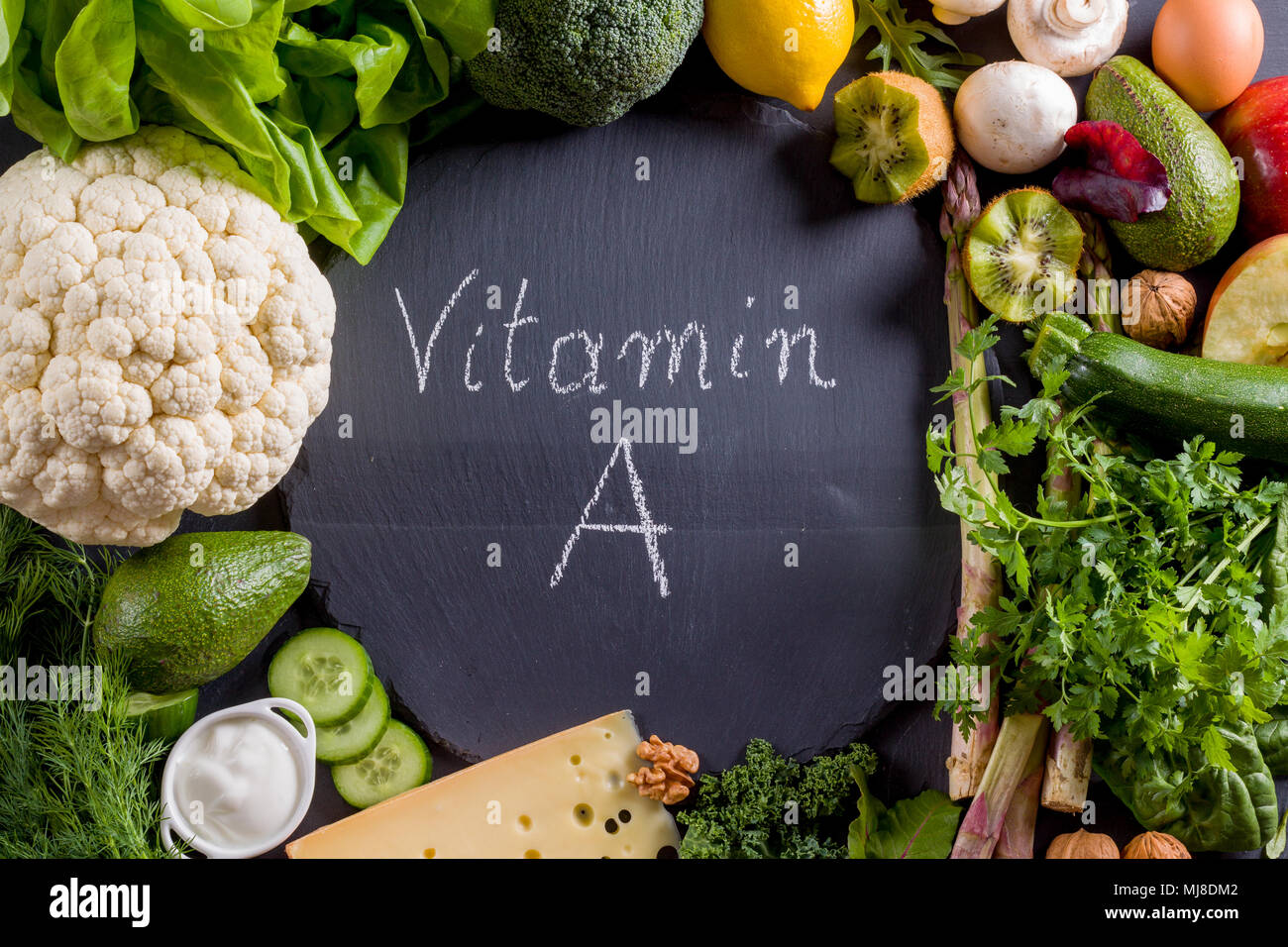 Green vegetables rich in vitamin A on black slate Stock Photo - Alamy