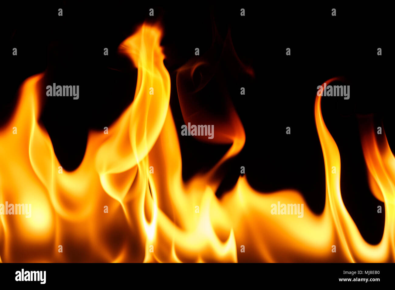 Real red flames in black space Stock Photo - Alamy