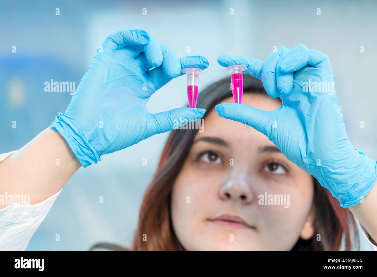 Laboratory woman hold test tubes hi-res stock photography and images ...