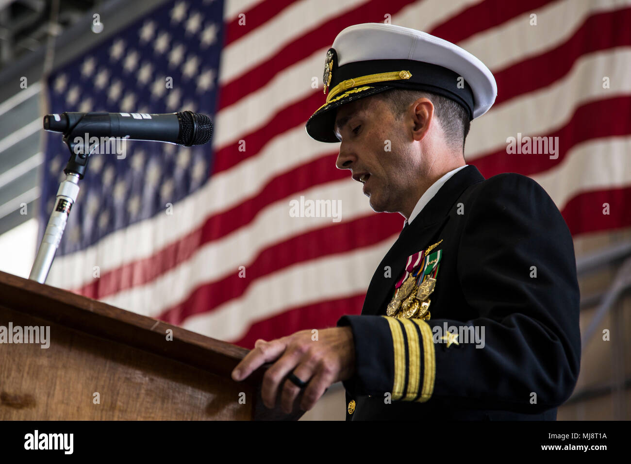 U.S. Navy Cmdr. Ryan Jackson, outbound commanding officer of Strike ...