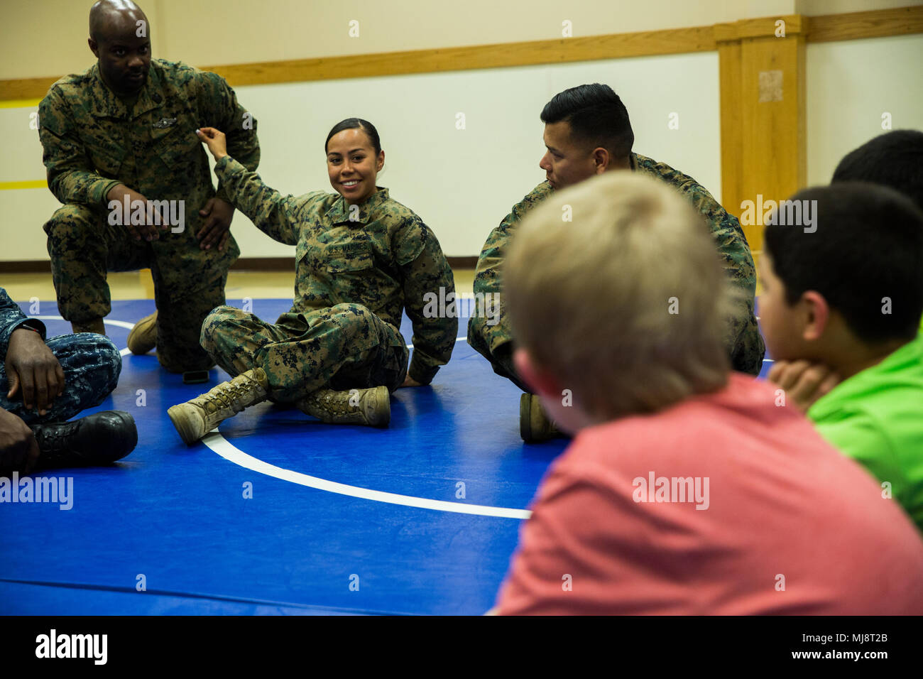 Marine Corps Sgt. Veronica J. Rios, center, an embarkation specialist ...
