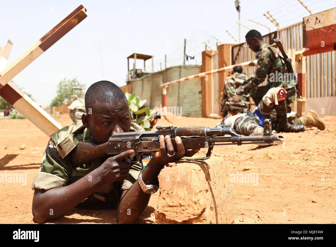 A Nigerien soldier posts security while conducting tactical combat ...