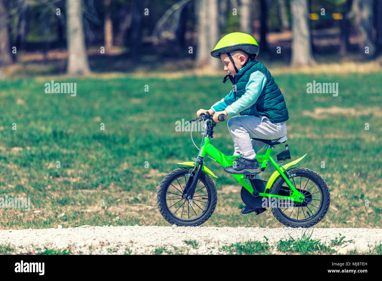 small kid training cycling on mountain road Stock Photo - Alamy