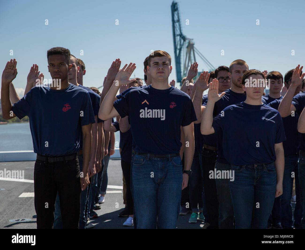 Oregon Navy and Marine Corps enlistees recite the Oath of Enlistment ...