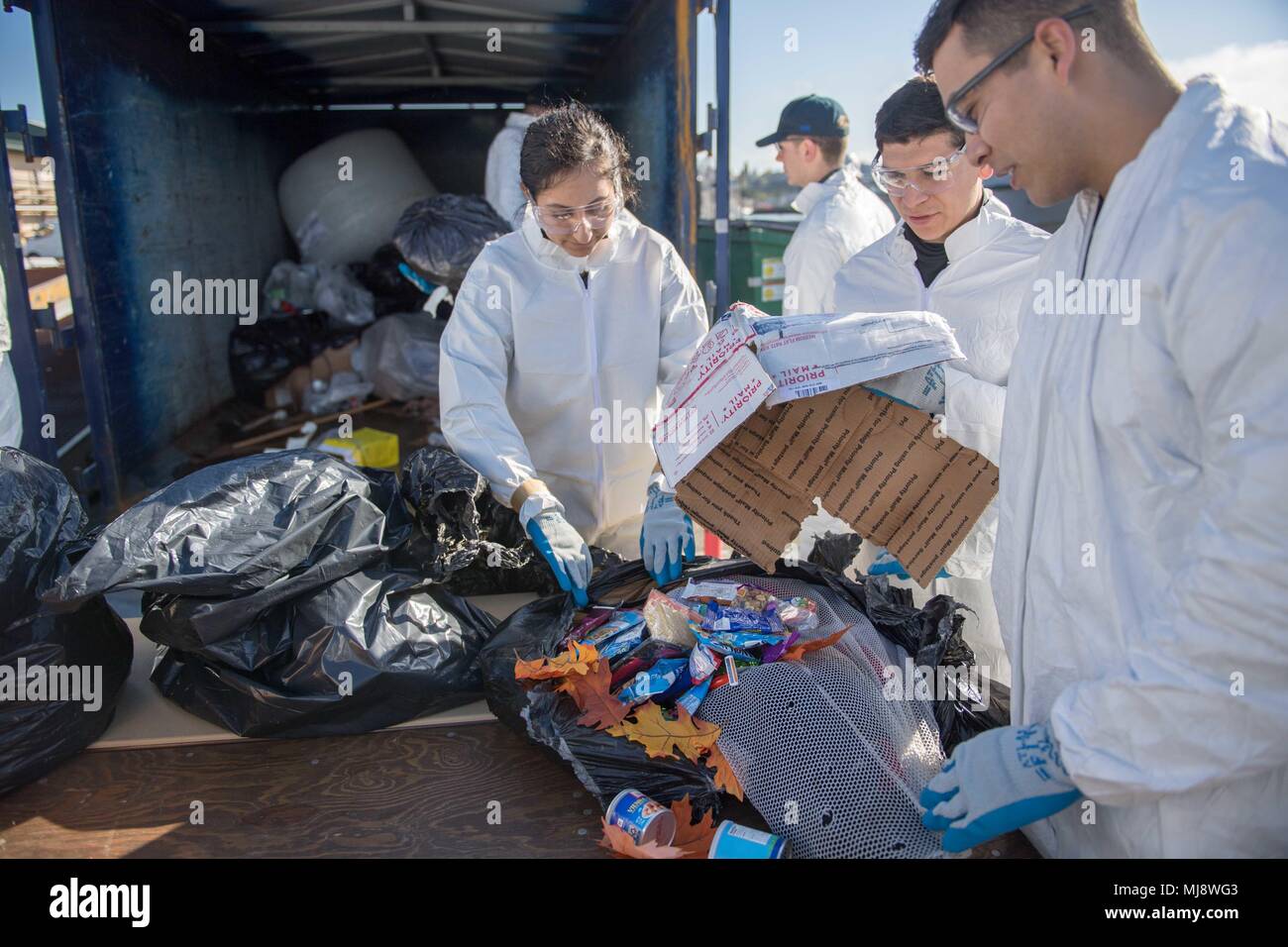 180419-N-DA737-0029 EVERETT, Wash. (April 19, 2016) Sailors sort trash ...