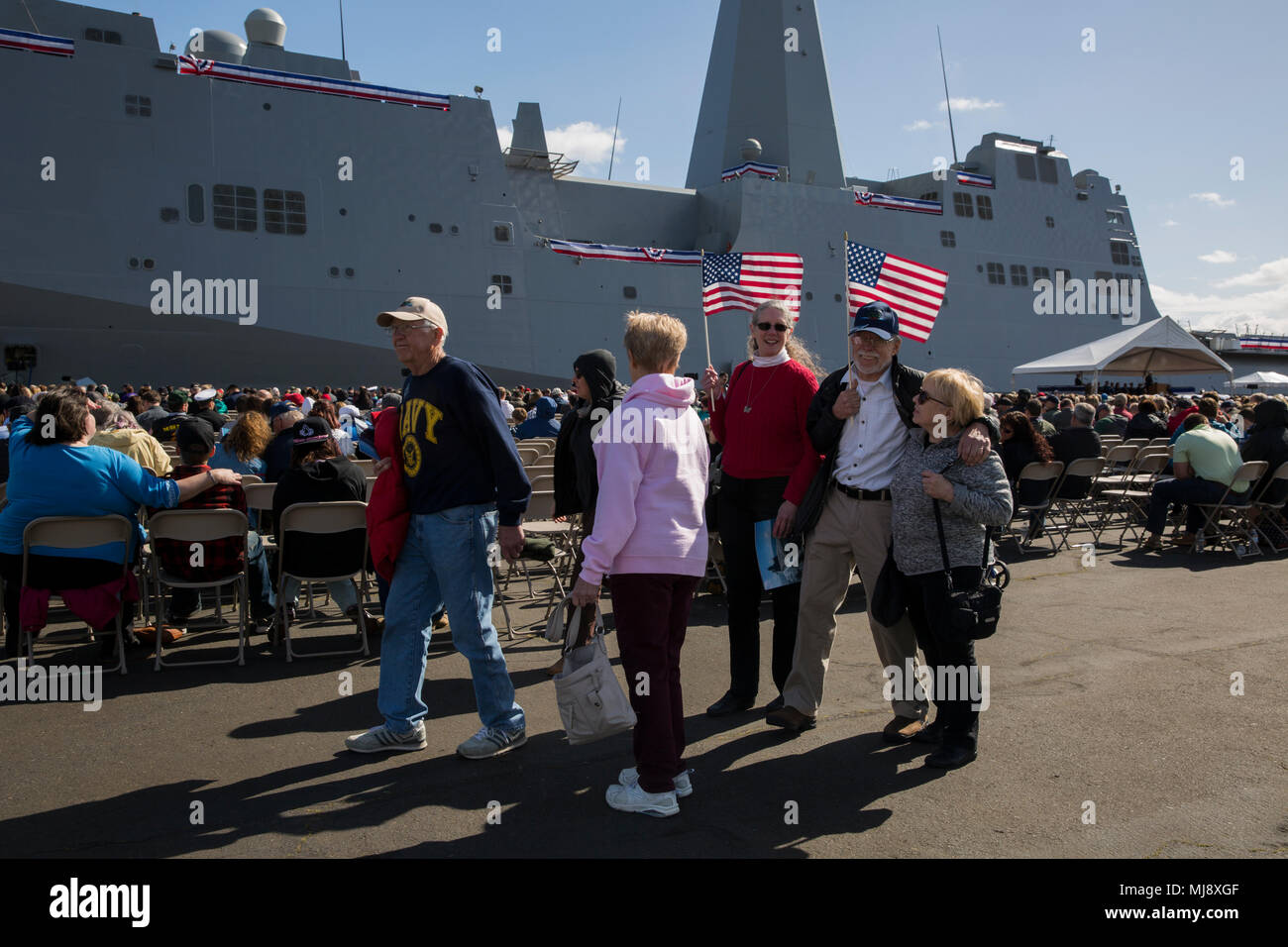 visitors take their seats during the official commissioning ceremony of ...