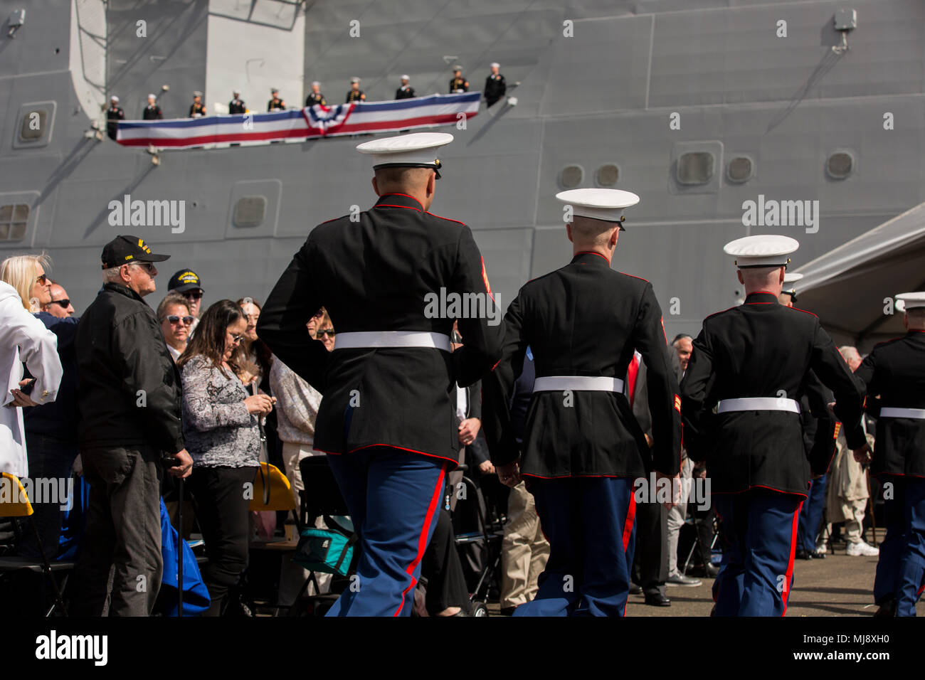 Marines file off to man USS Portland (LPD 27) during her official ...
