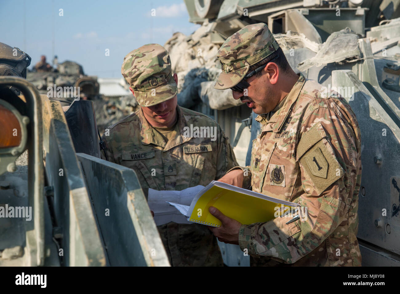 U.S. Army 1st Sgt. Sergio Partida and Staff Sgt. Cody Vance, both ...