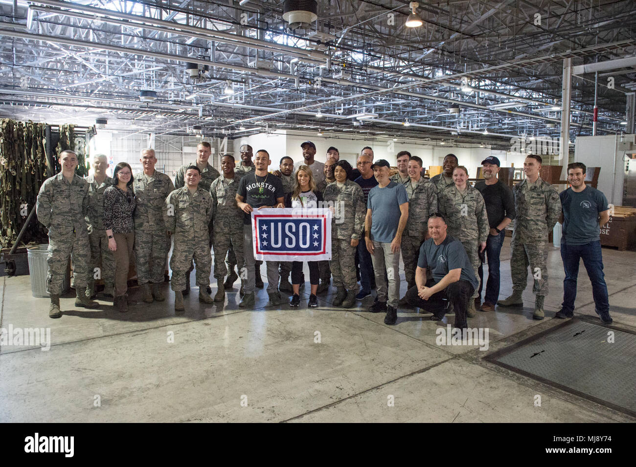 Entertainers pose for a photo with members of the 730th Air Mobility ...