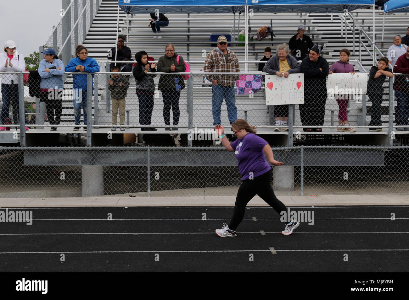 An athlete closes in on the finish line during the Special Olympics ...