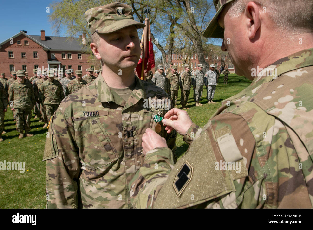 Col. Sean Campion, commander of the 96th Sustainment Brigade, pins an ...