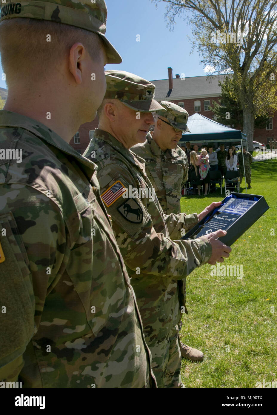 Col. Sean Campion, commander of the 96th Sustainment Brigade, presents ...
