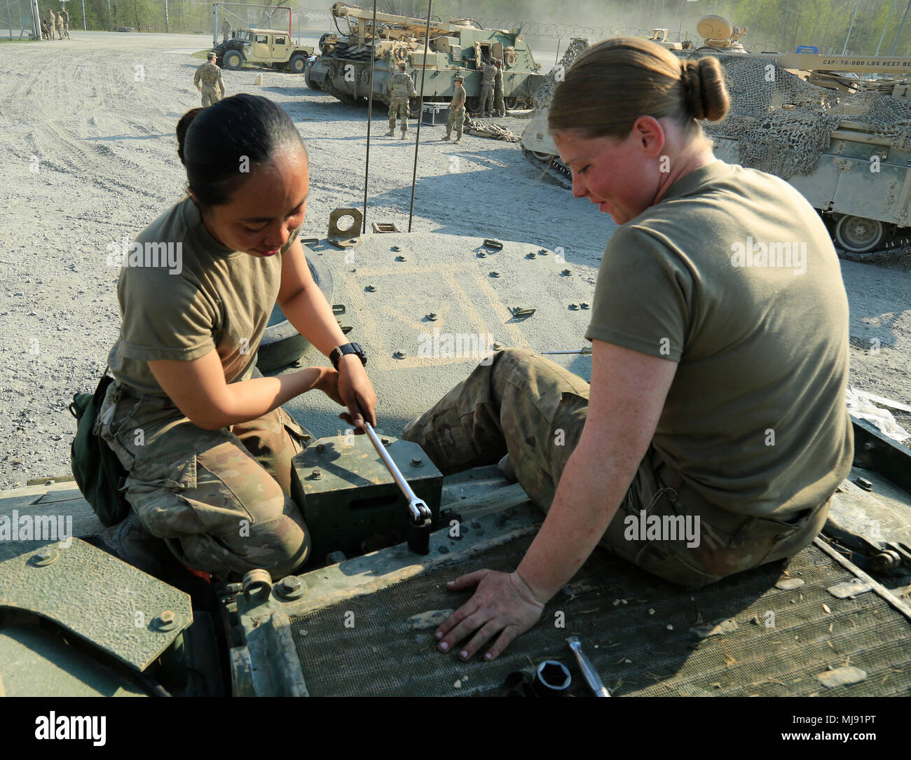 U.S. Army Sgt. Leonalyn Barnes (left) and Spc. Haley Haye, assigned to ...