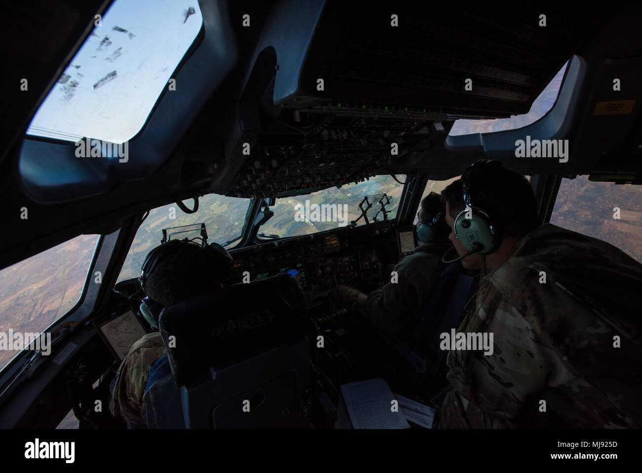 U.S. Air Force Lt. Col. Corey Akiyama, looks on as Maj. Derik Neitz ...