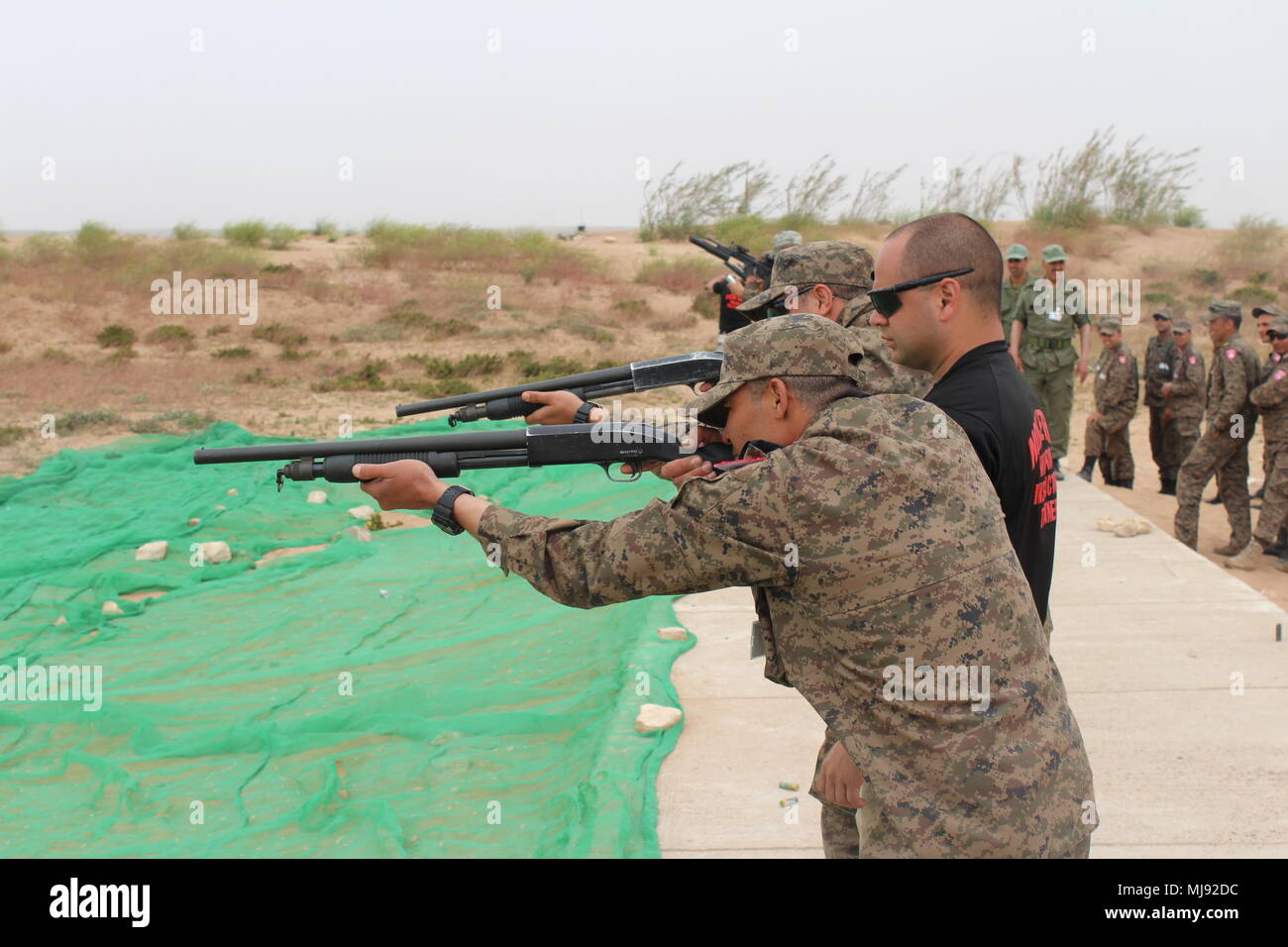 Tunisian soldiers take aim down range with shotguns for non-lethal ...