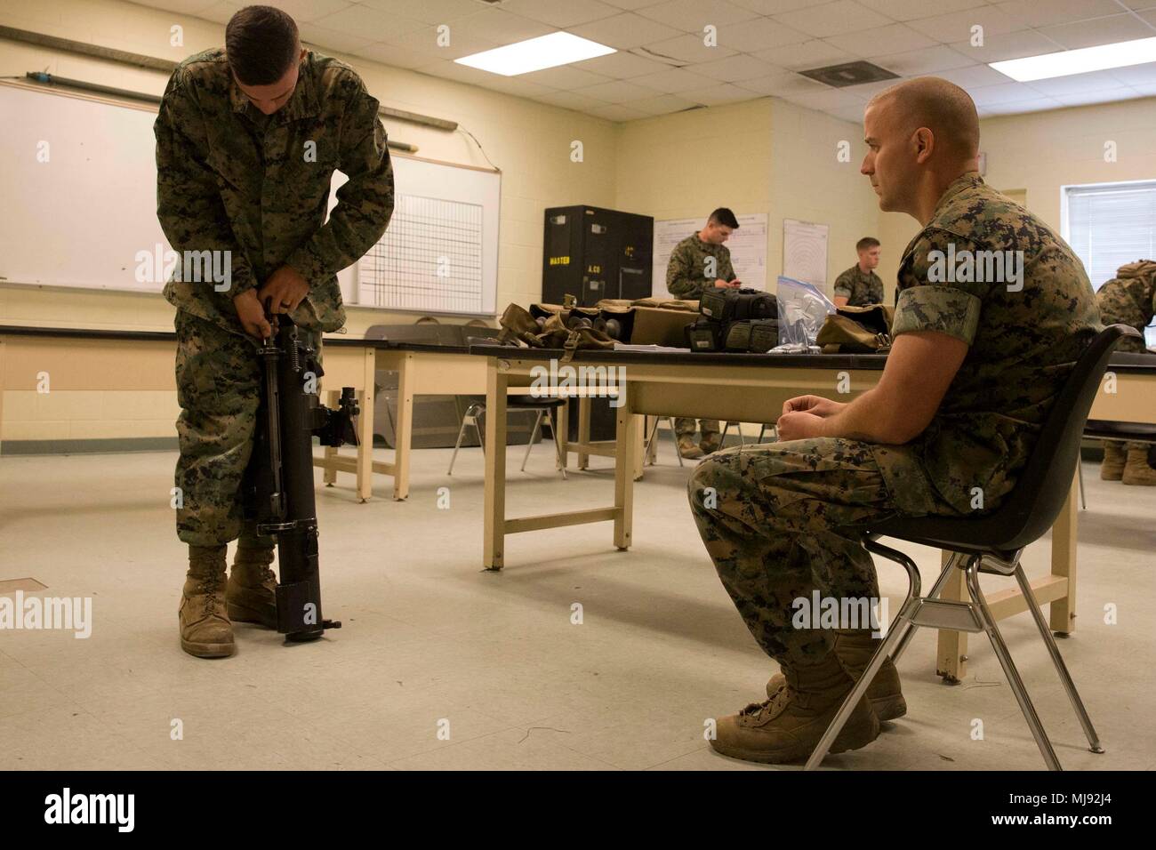Sgt. Steven Carter, right, infantry assaultman instructor, evaluates ...